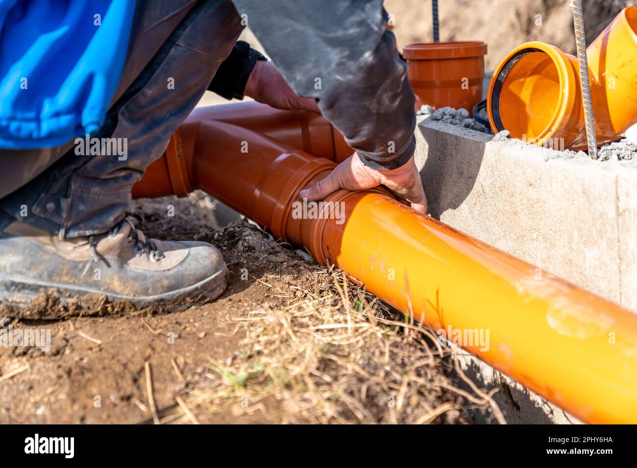installation of a sewage plastic pipe during the construction of a ...