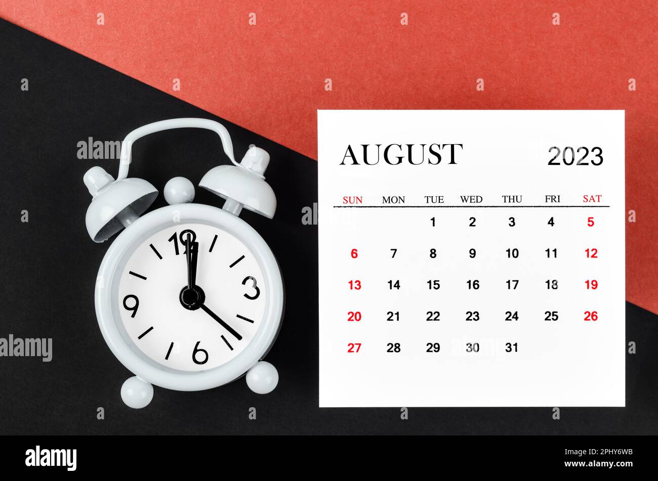 August 2023 Monthly calendar year with alarm clock on red and black ...