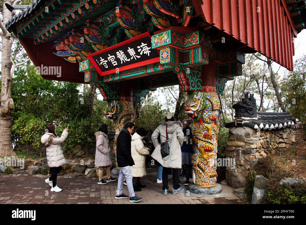 Korean people and foreign travelers walking passing gate entrance ...
