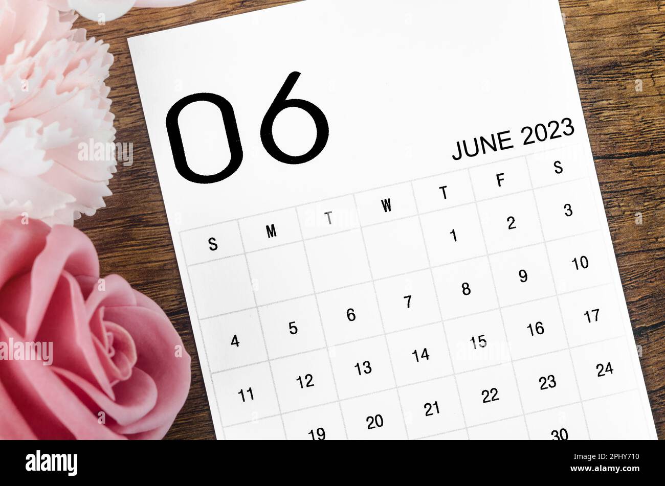 June 2023 Monthly calendar for 2023 year with pink rose on wooden background Stock Photo - Alamy