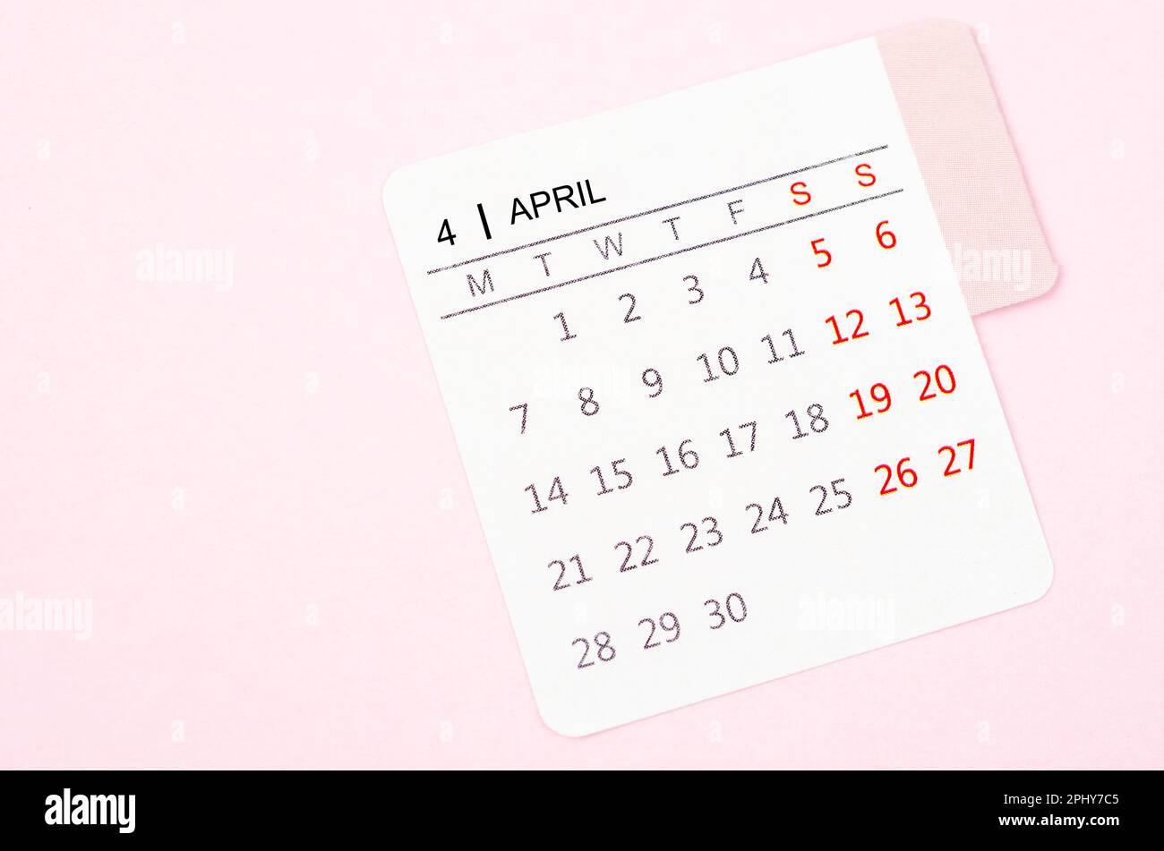 Mini April calendar on a pink color background. High resolution and ...