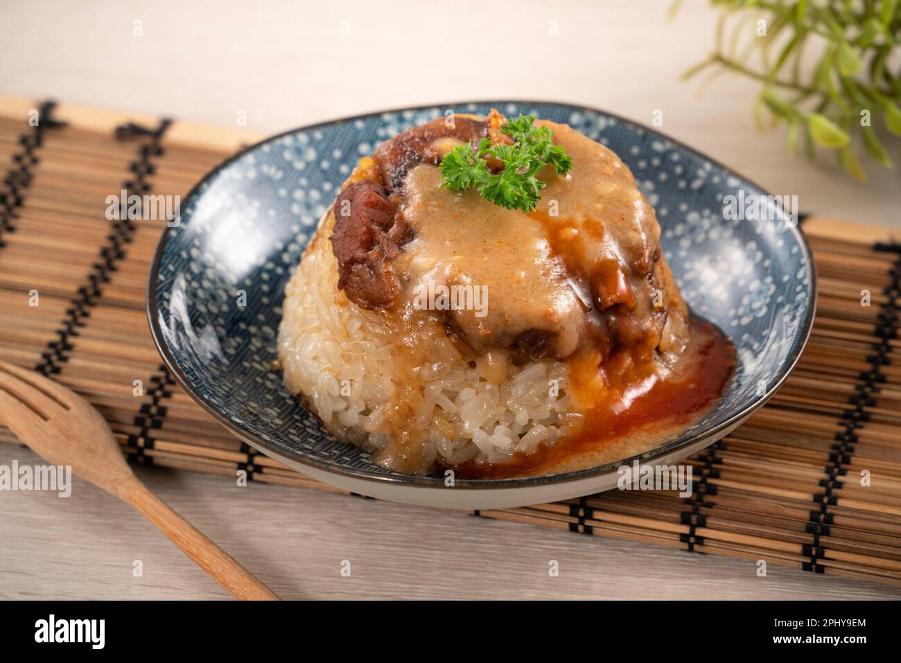 Migao, tube rice cake, rice pudding in a bowl topped with minced pork ...