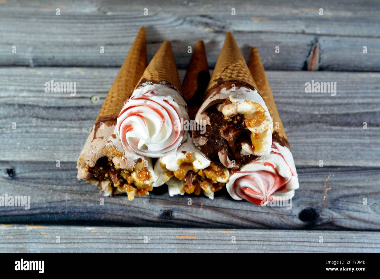 Ice cream vanilla and chocolate cones with topping of chocolate and ...