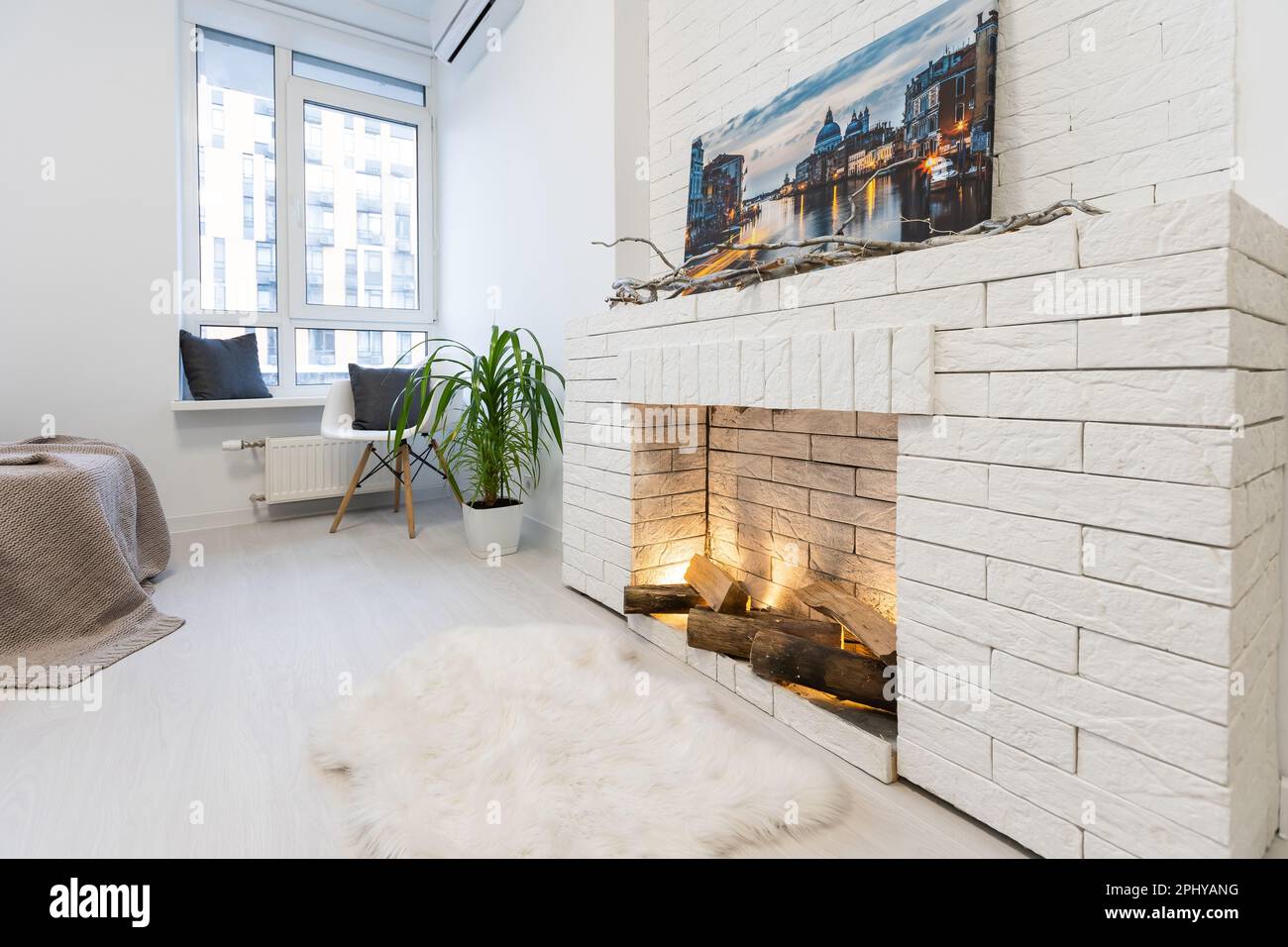 Modern interior house with bright living room, fire in new fireplace ...