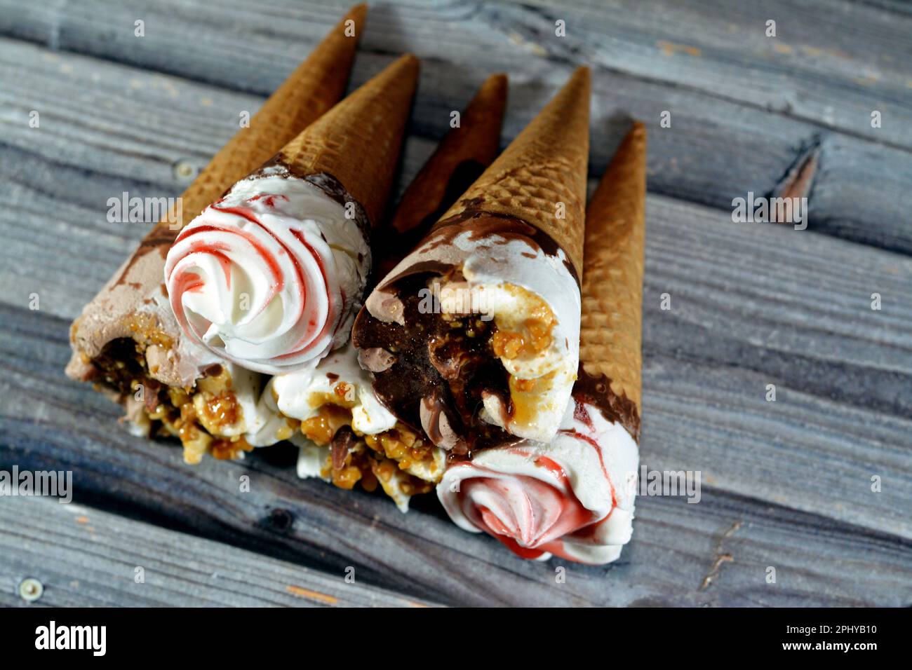 Ice cream vanilla and chocolate cones with topping of chocolate and ...