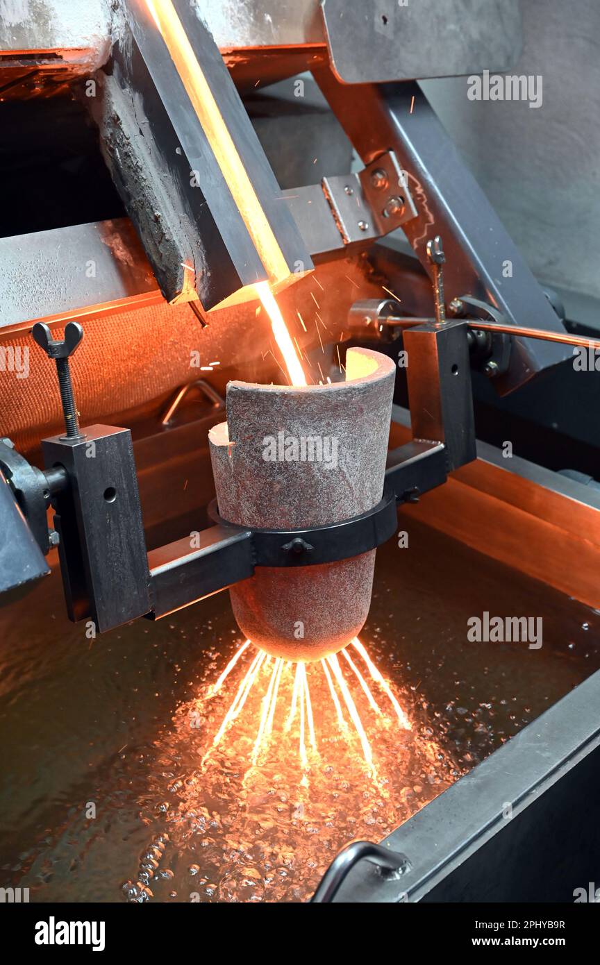 Pforzheim, Germany. 20th Mar, 2023. At Agosi AG in Pforzheim, gold granules are cast that have a ...