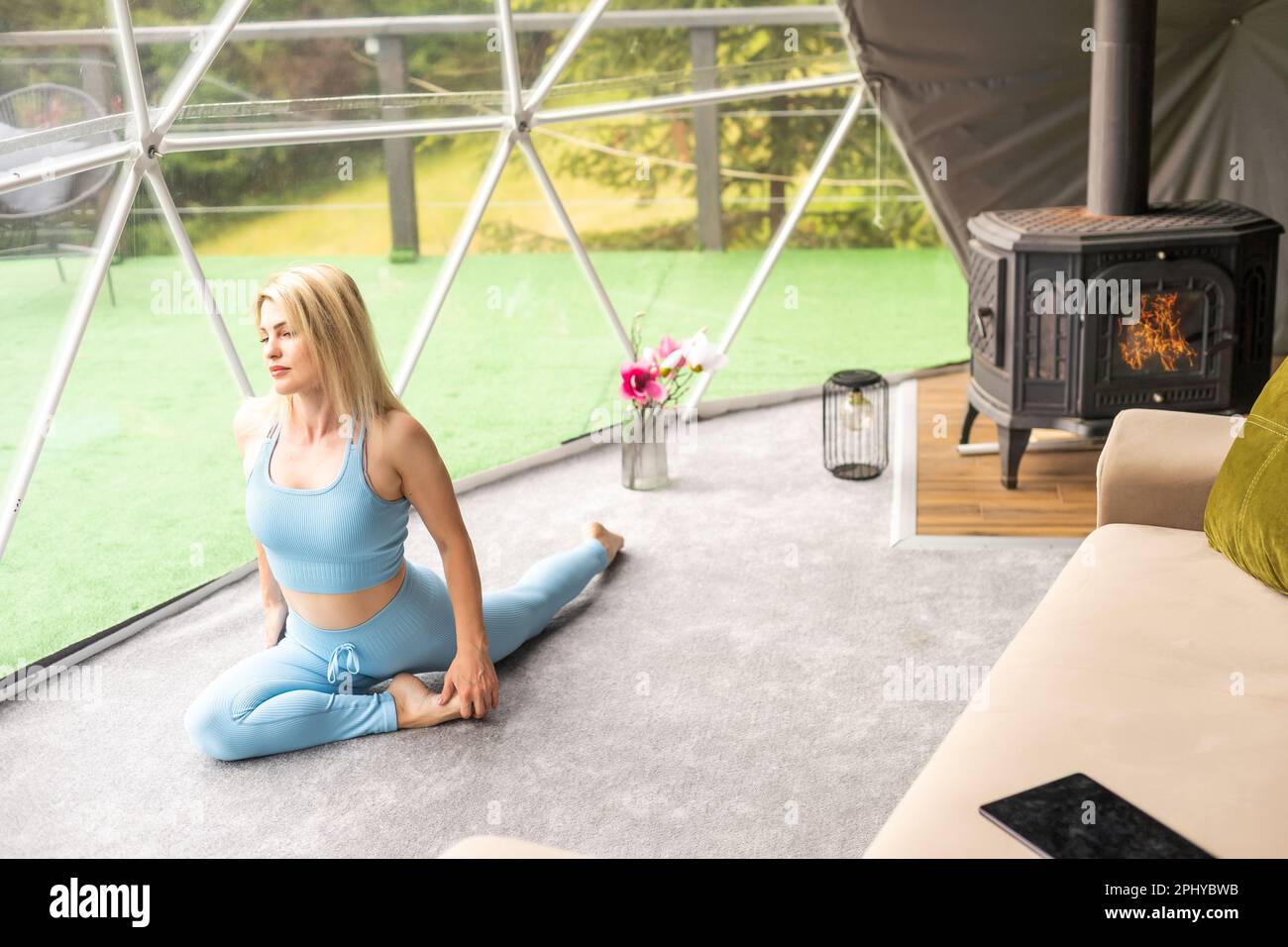A woman is in a geo dome glamping tent. Glamping vacation lifestyle ...