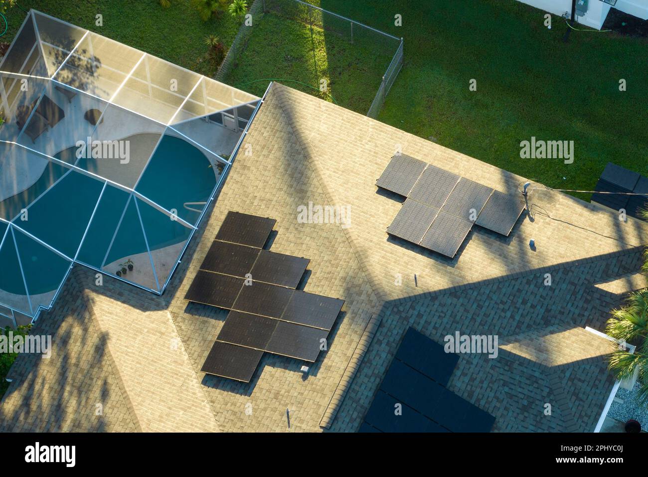 Aerial view of typical american building roof with rows of blue solar ...