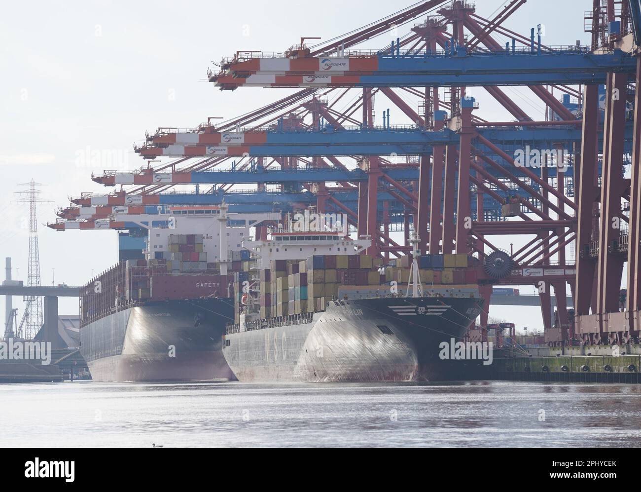 Hamburg, Germany. 30th Mar, 2023. Container ships are handled at the Eurogate Container Terminal ...