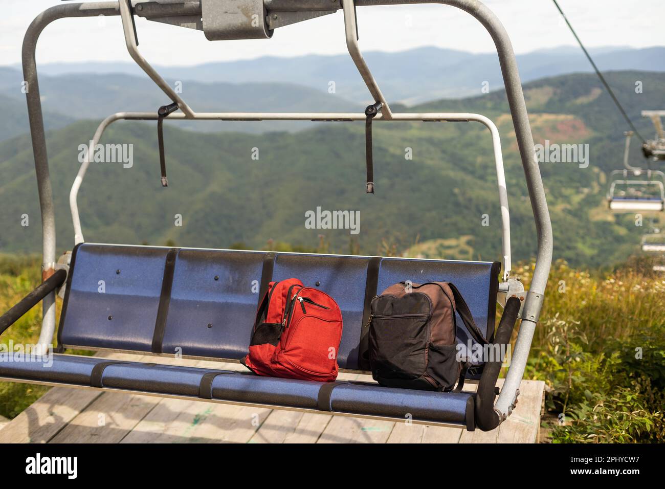 backpacks on the chair lift Stock Photo - Alamy