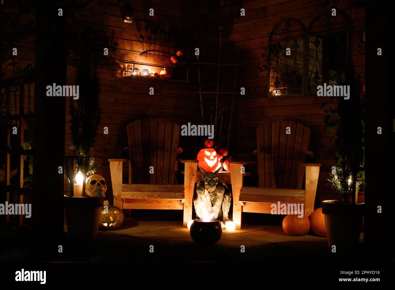 an outdoor Halloween-themed setting with wooden benches and pumpkins ...