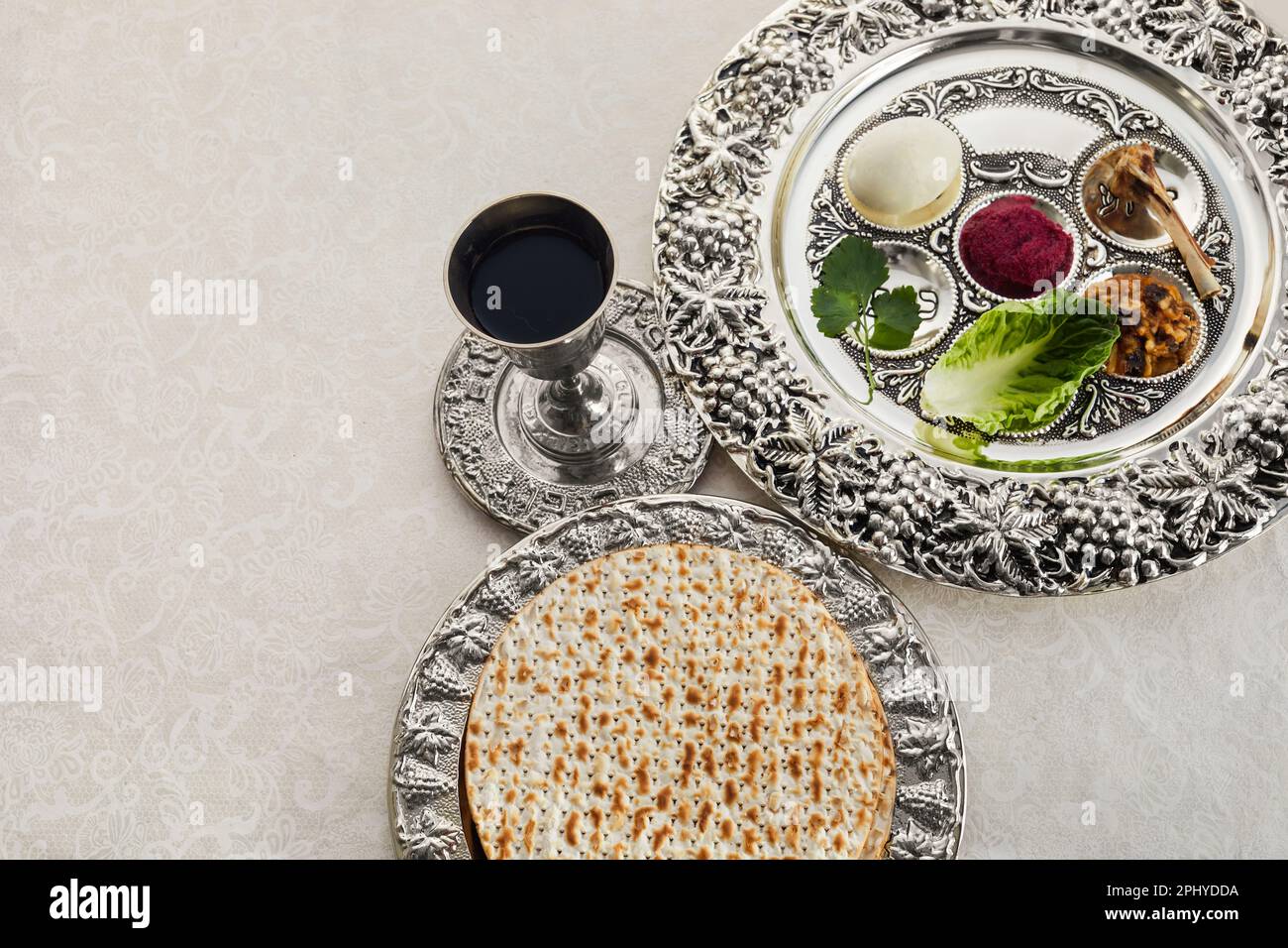 Composition with symbolic Passover, Pesach, items and meal on vintage ...
