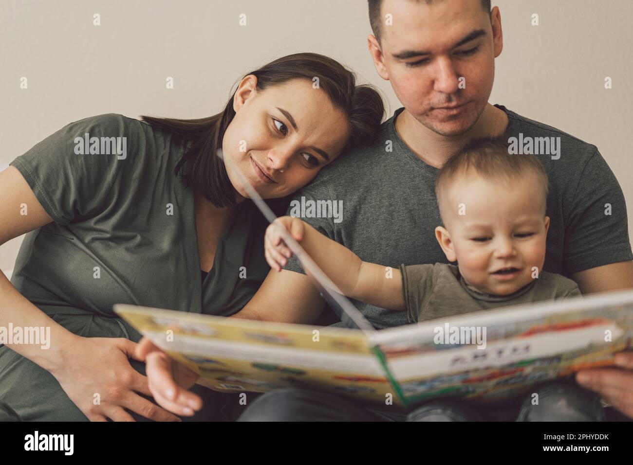 Family Love. Parents and Little Son Reading Book Together Stock Photo ...