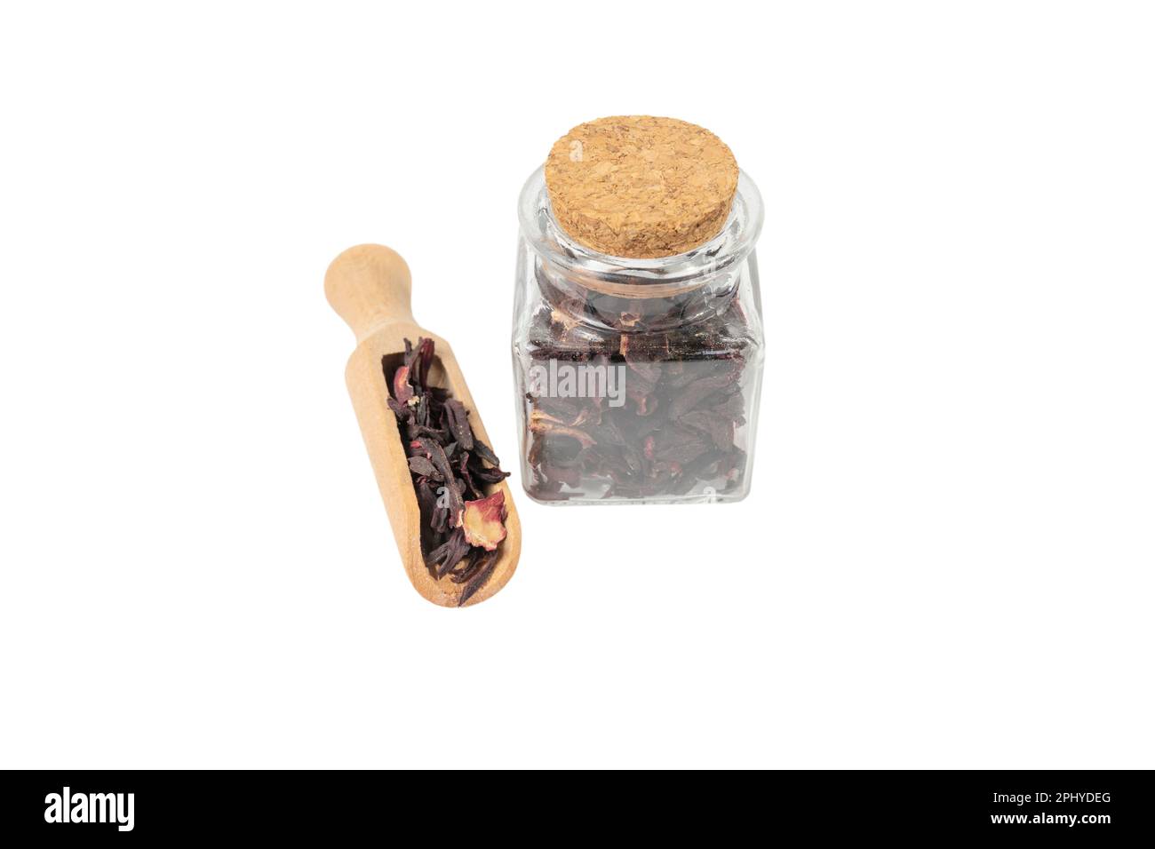 Dry hibiscus tea in wooden scoop and glass jar isolated on white background. herb. herbal tea ...
