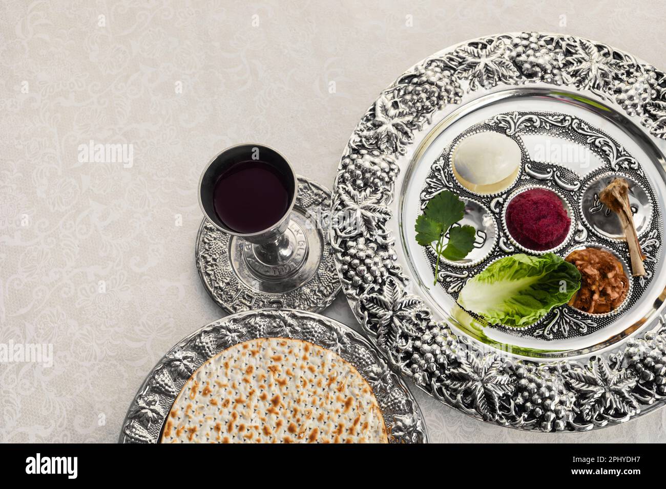 Composition with symbolic Passover, Pesach, items and meal on vintage ...