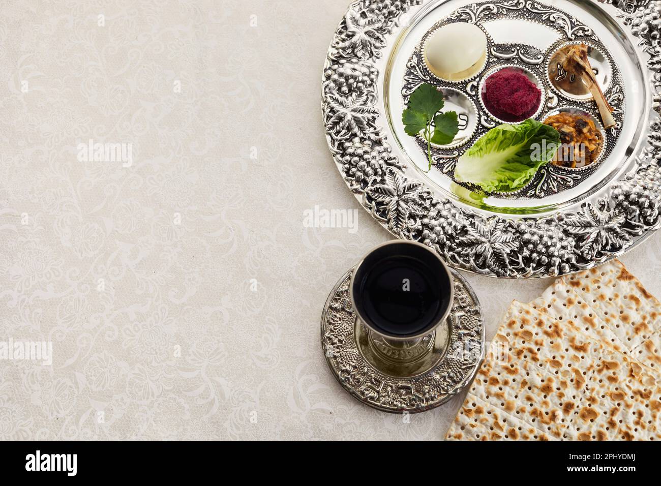 Composition with symbolic Passover, Pesach, items and meal on vintage ...