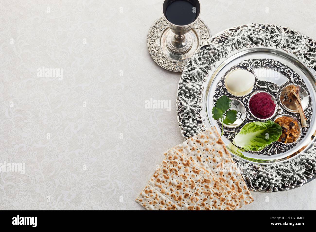 Composition with symbolic Passover, Pesach, items and meal on vintage ...
