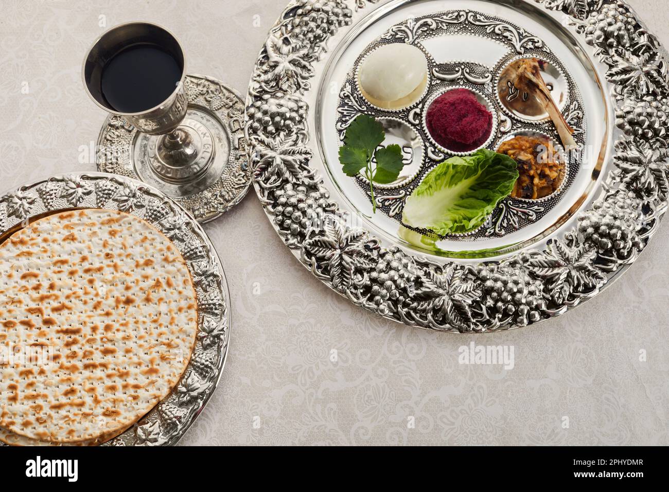 Composition with symbolic Passover, Pesach, items and meal on vintage ...