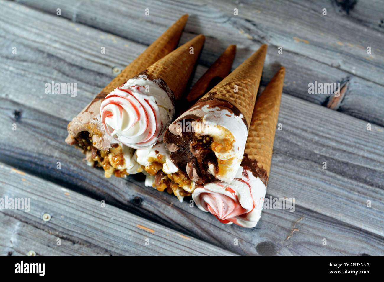 Ice cream vanilla and chocolate cones with topping of chocolate and ...