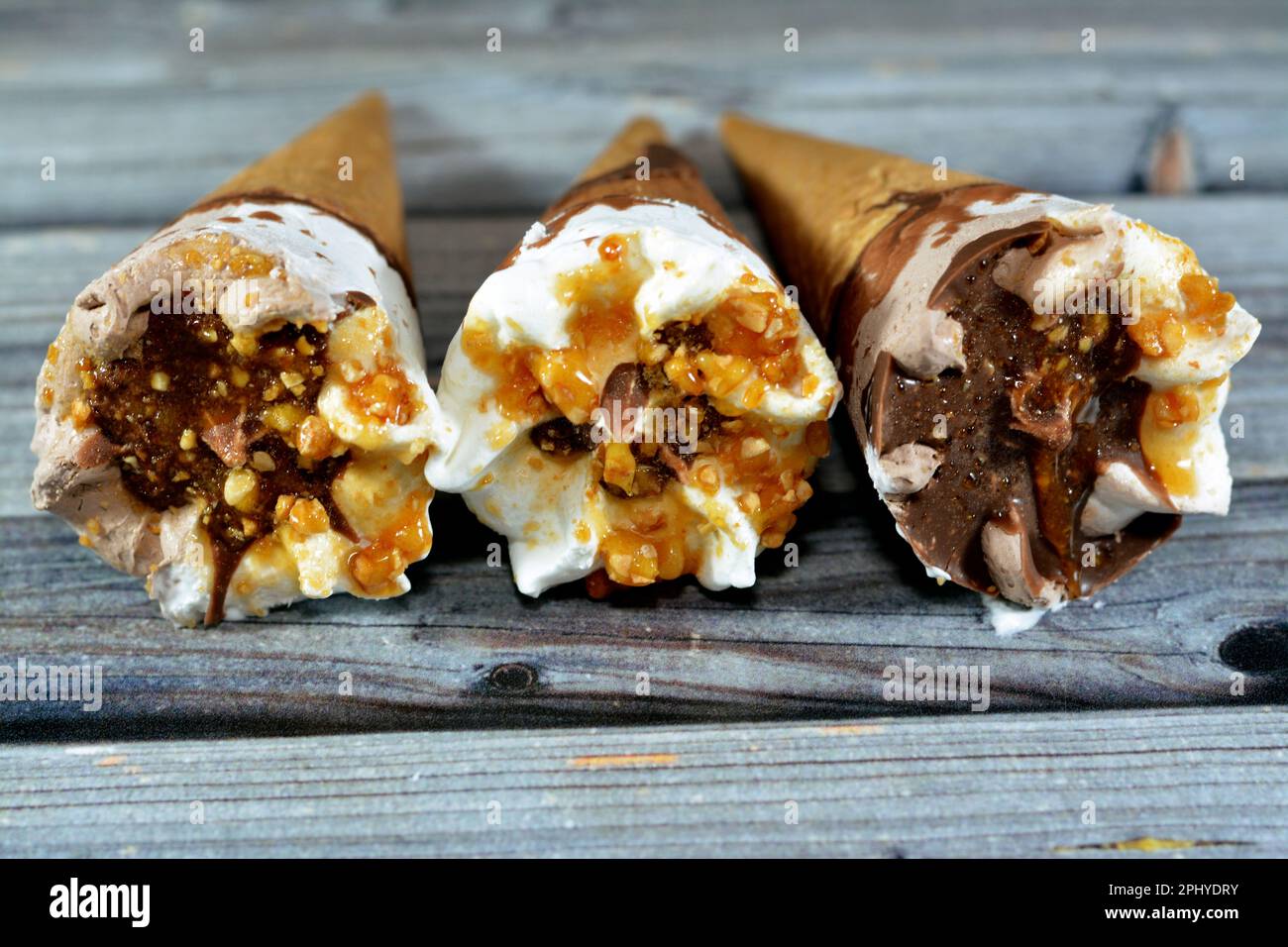 Ice cream vanilla and chocolate cones with topping of chocolate and ...