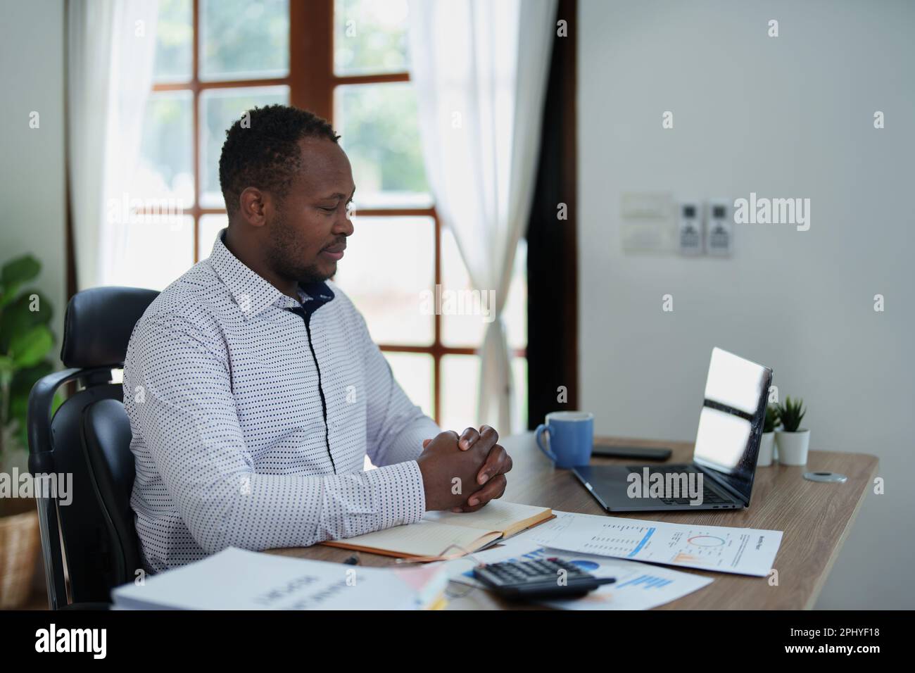 middle aged man American African business man holding computer laptop ...