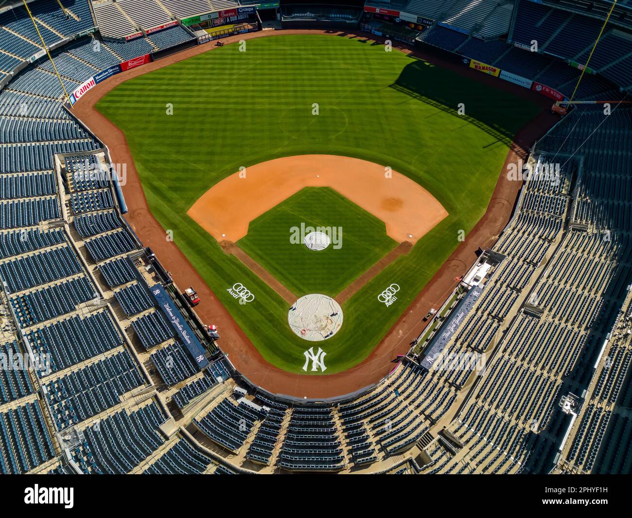 An aerial view of a Yankee Stadium featuring a grass field on a sunny ...
