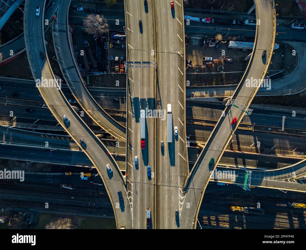 An aerial view of a busy city highway intersection with a variety of ...