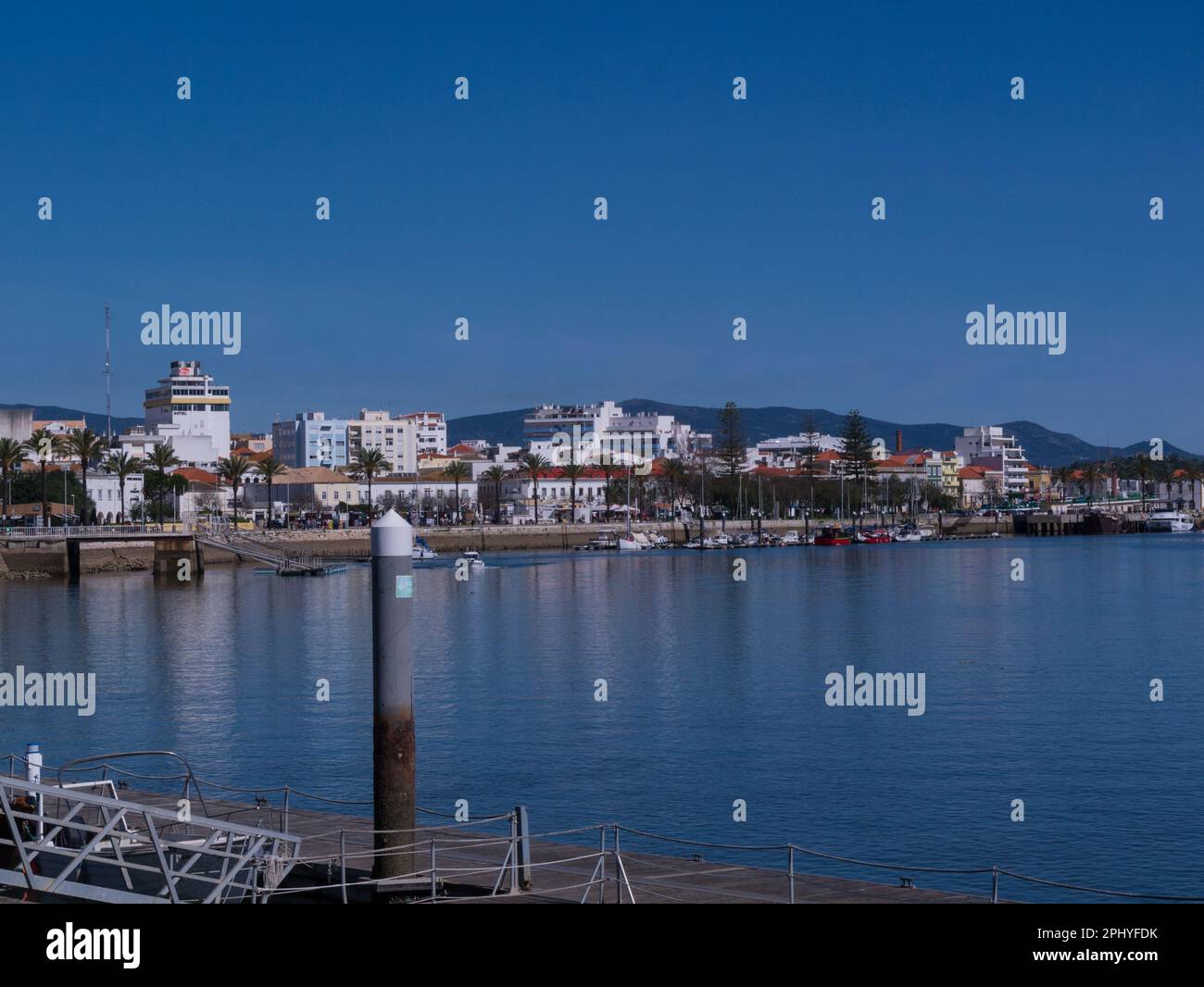 View across River Arade to Portimao marina and seaside high rise ...