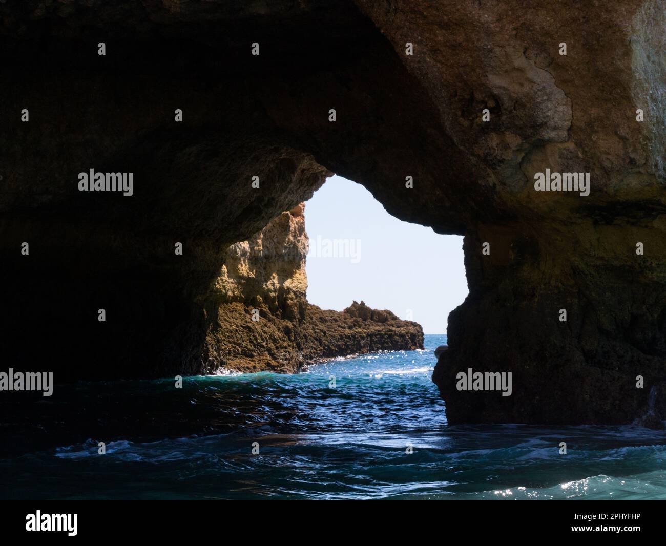 Inside one of the golden sandstone caves along the Algarve Atlantic ...