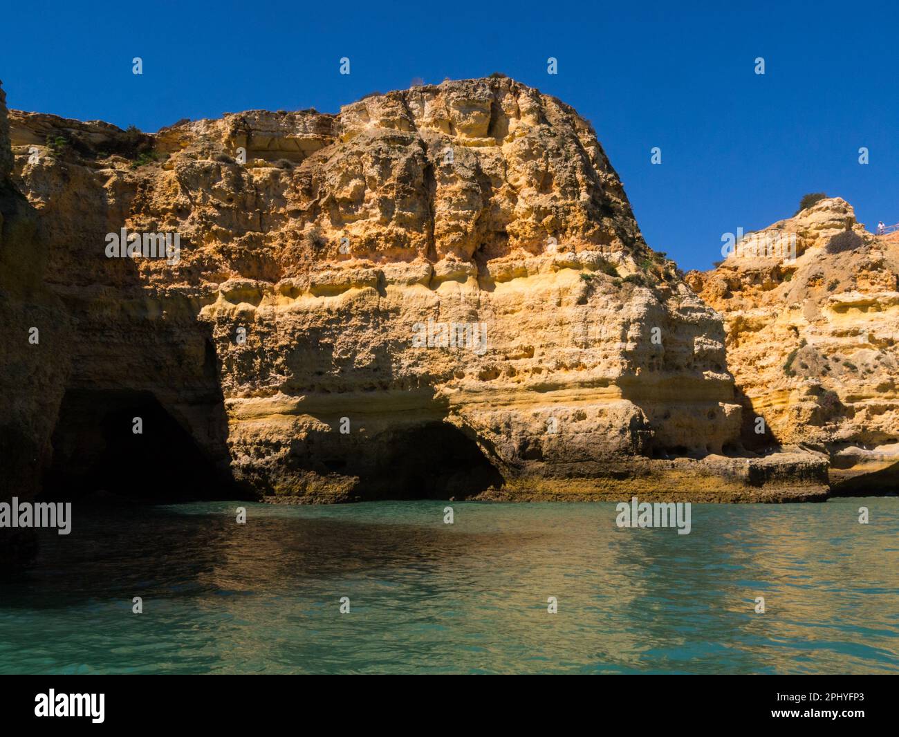 Caves along algarve atlantic ocean coast in cliffs hi-res stock ...