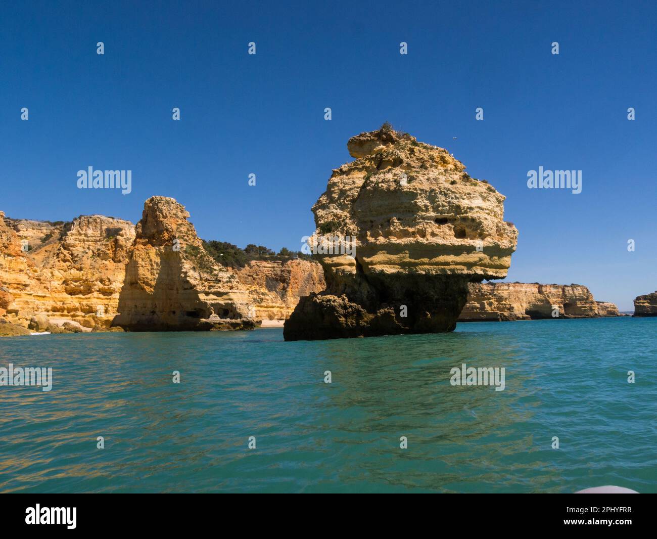 Columns of sandstone cliffs along algarve coast hi-res stock ...