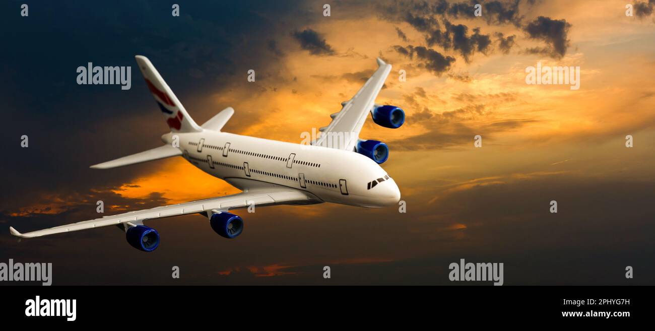 White passenger airplane flying in the sky amazing clouds in the ...