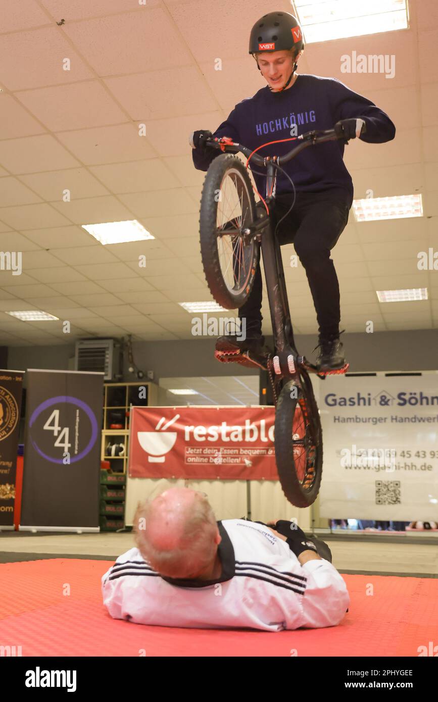 Hamburg, Germany. 30th Mar, 2023. Thomas Klausner jumps over a prone ...