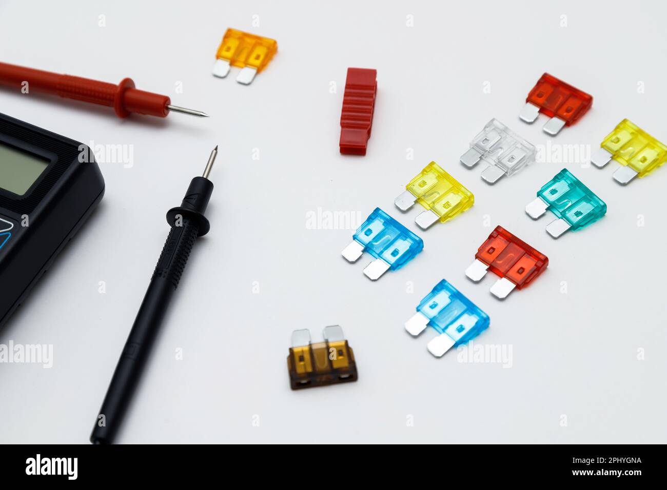 Digital multimeter for measuring electrical elements and car fuses on a ...