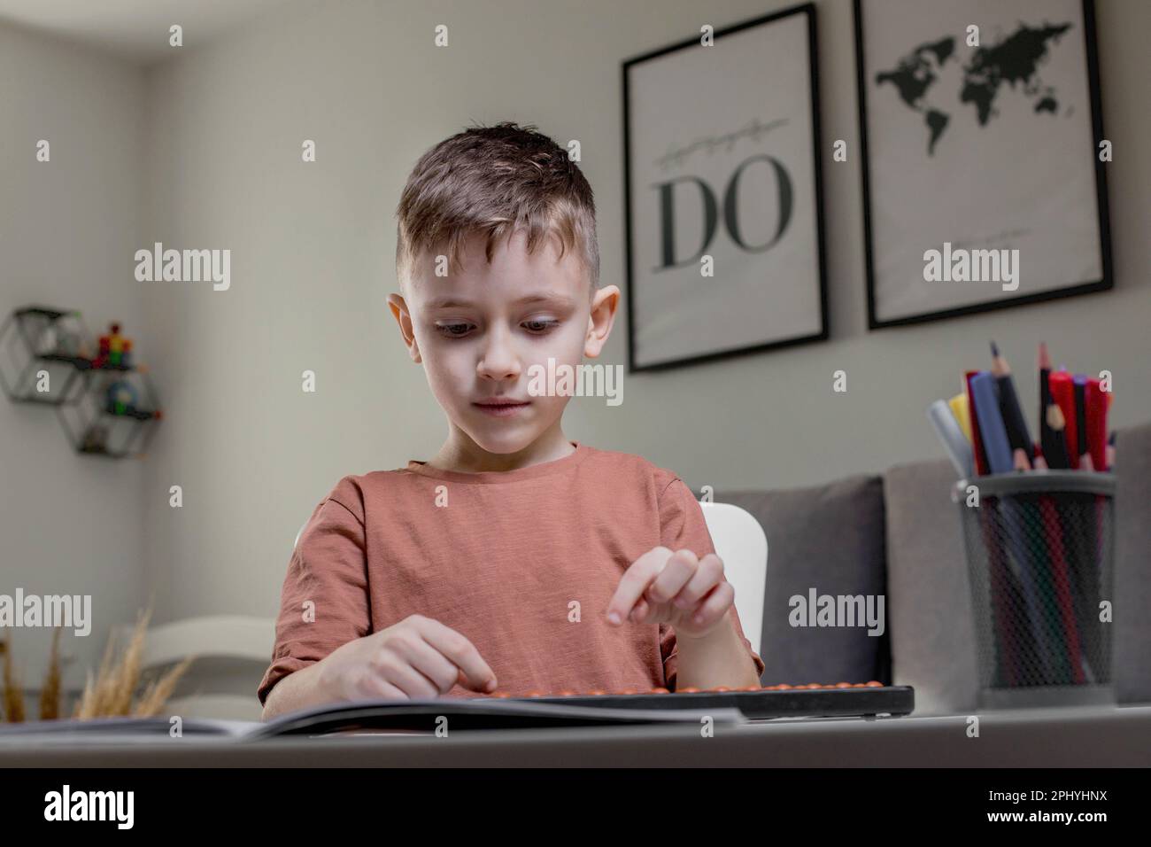 Little boy counting with the help of mental arithmetic. Mathematics in ...