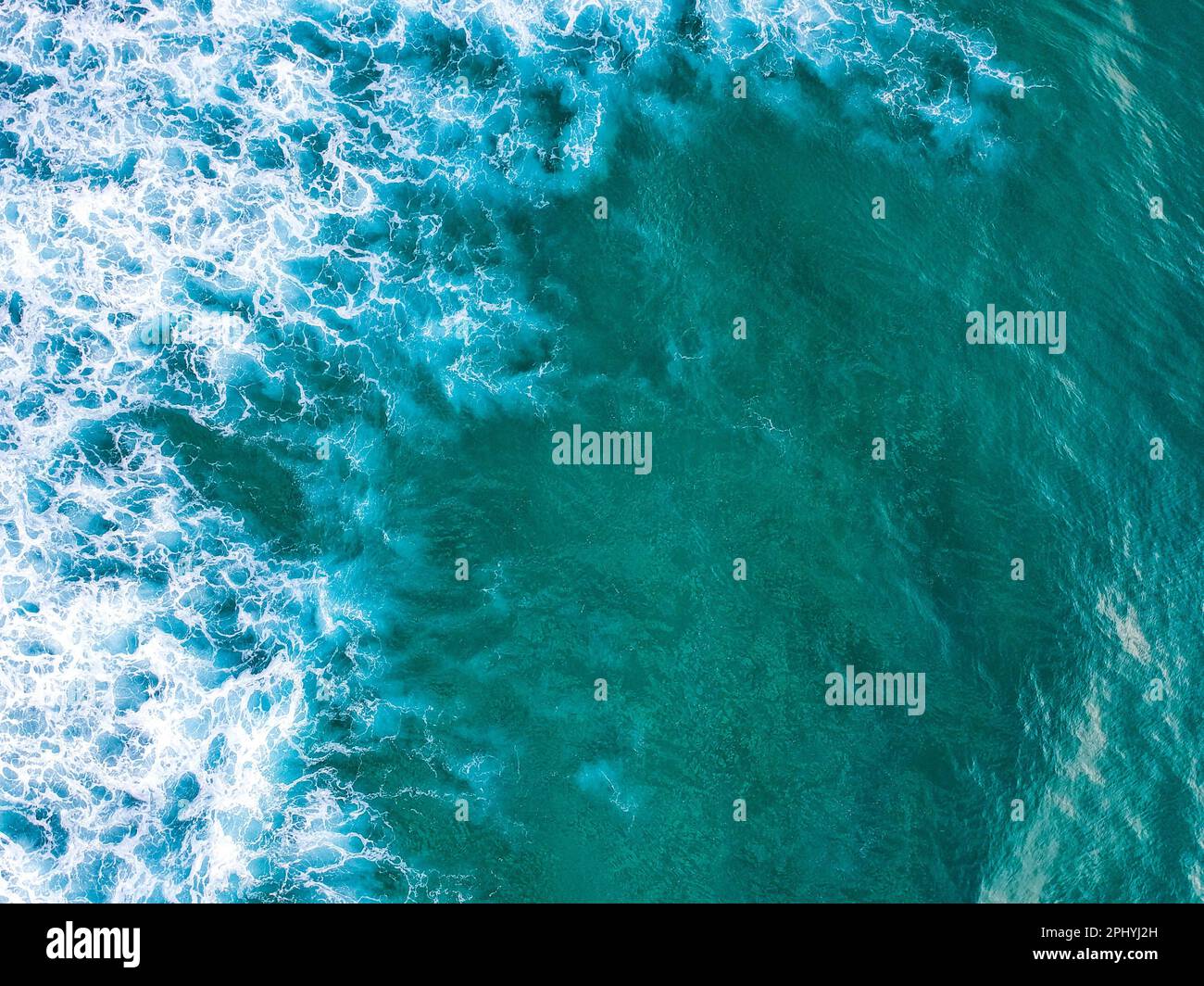 An aerial view of calm waves of the crystal clear sea Stock Photo - Alamy