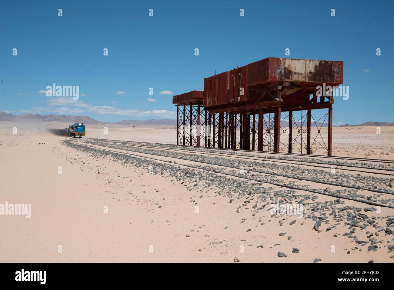 A vintage, corroded metal structure situated in a desert landscape with ...