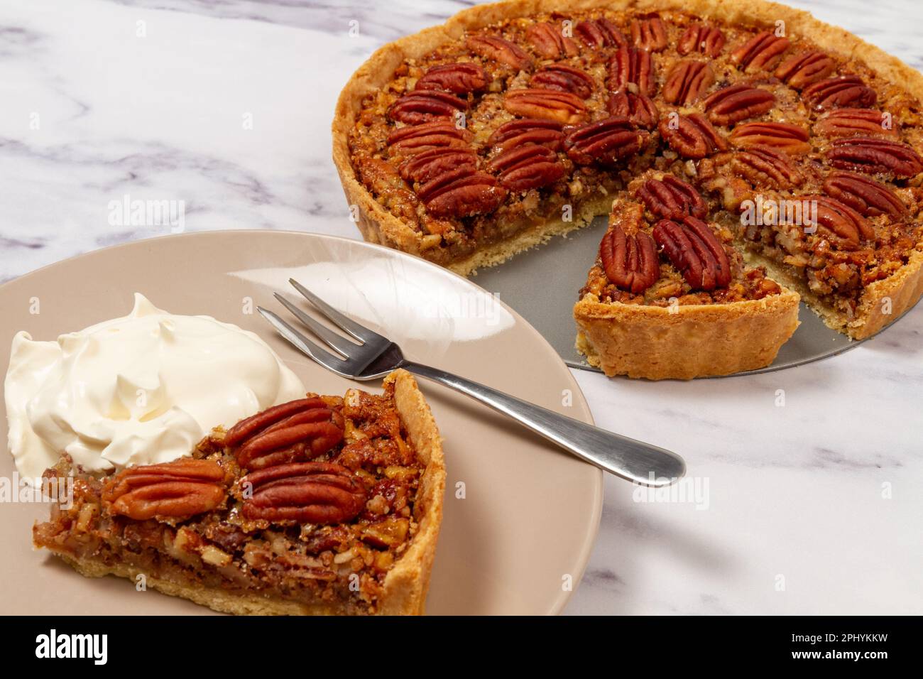 Pecan pie portion with maple cream Stock Photo - Alamy