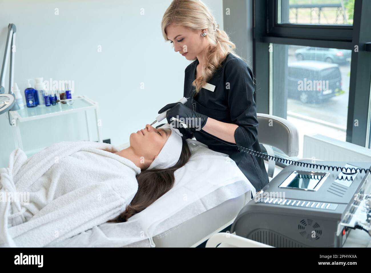 Medical worker doing skin rejuvenation, working in salon Stock Photo ...