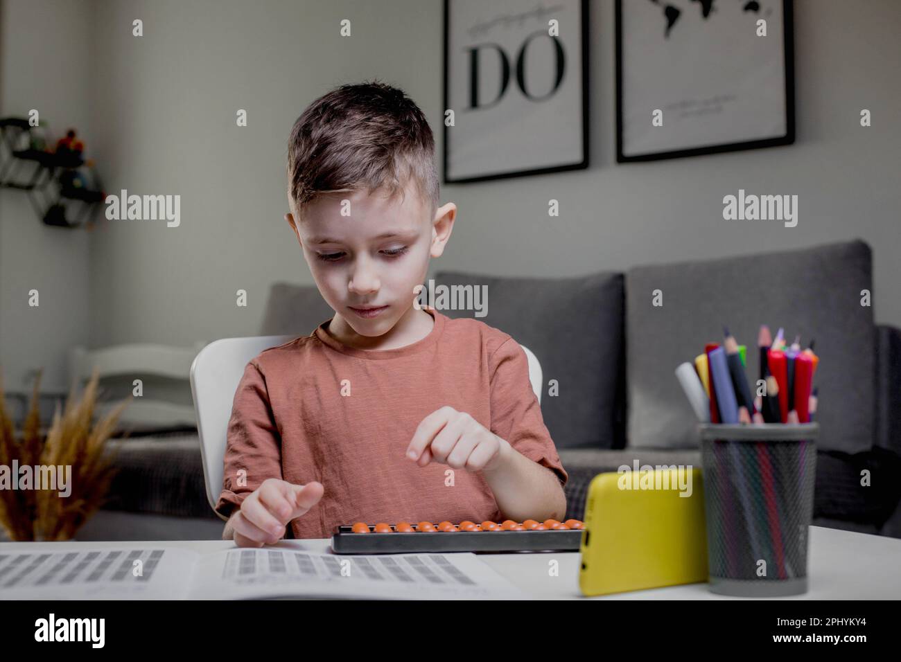 Little boy counting with the help of mental arithmetic. Mathematics in ...