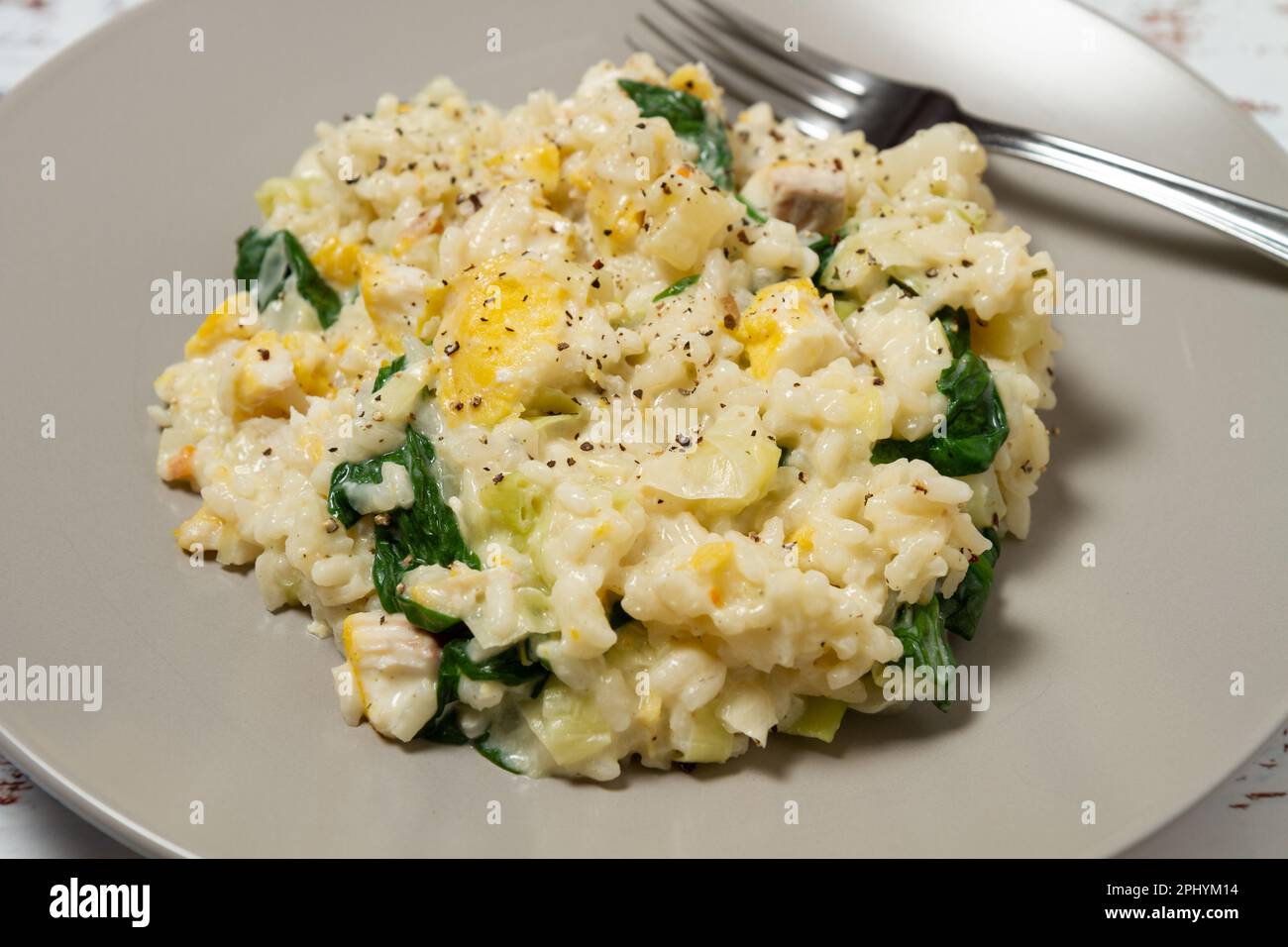 Smoked haddock and leek risotto, plated portion Stock Photo - Alamy