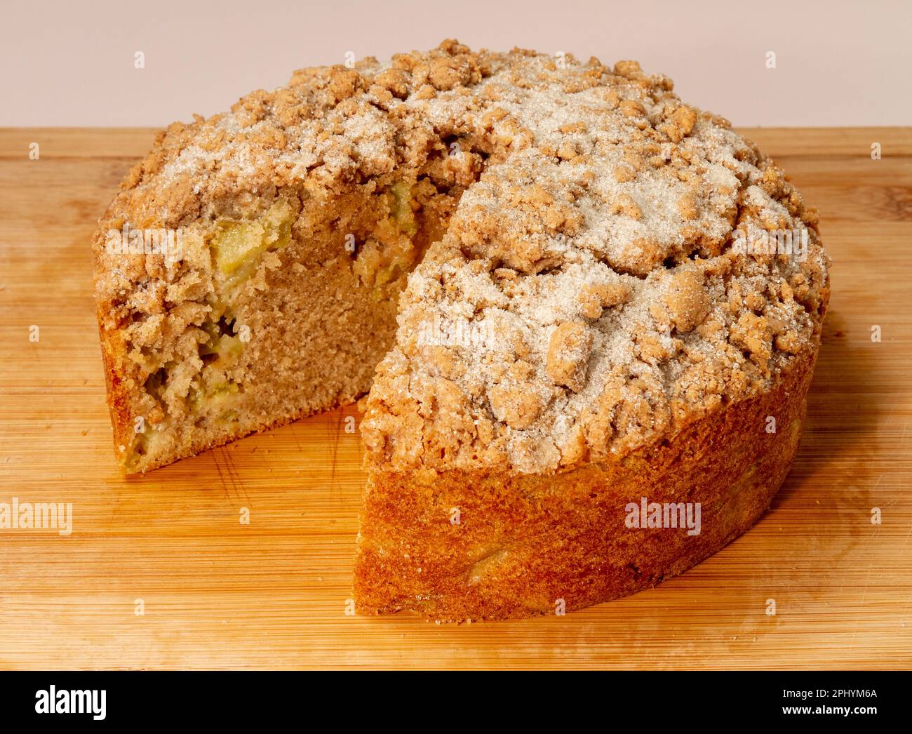 Rhubarb crumble cake with slice removed Stock Photo - Alamy