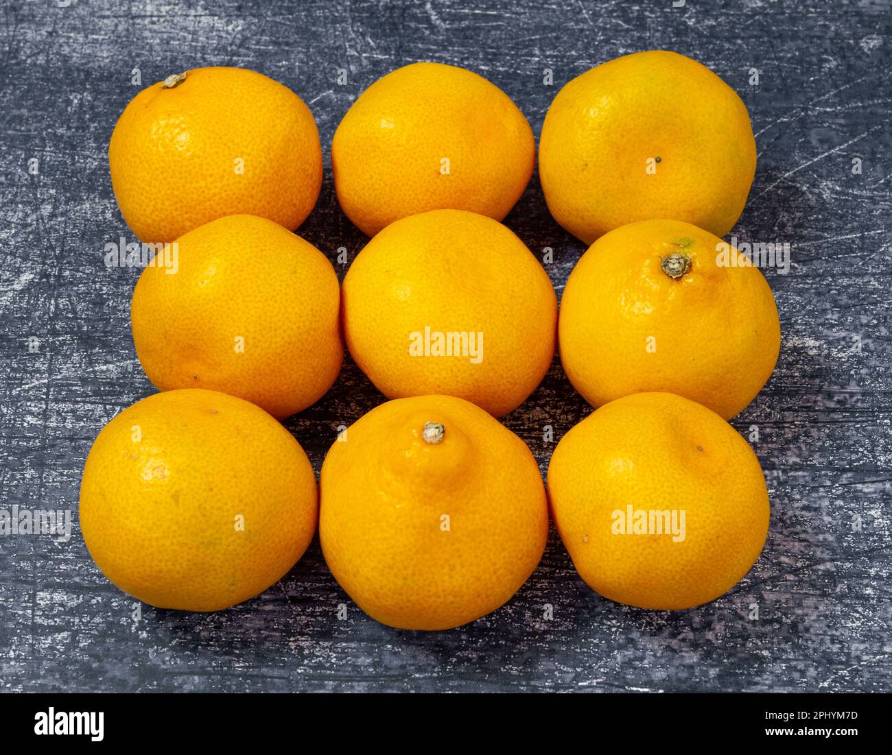9 Satsumas arranged in a square Stock Photo - Alamy