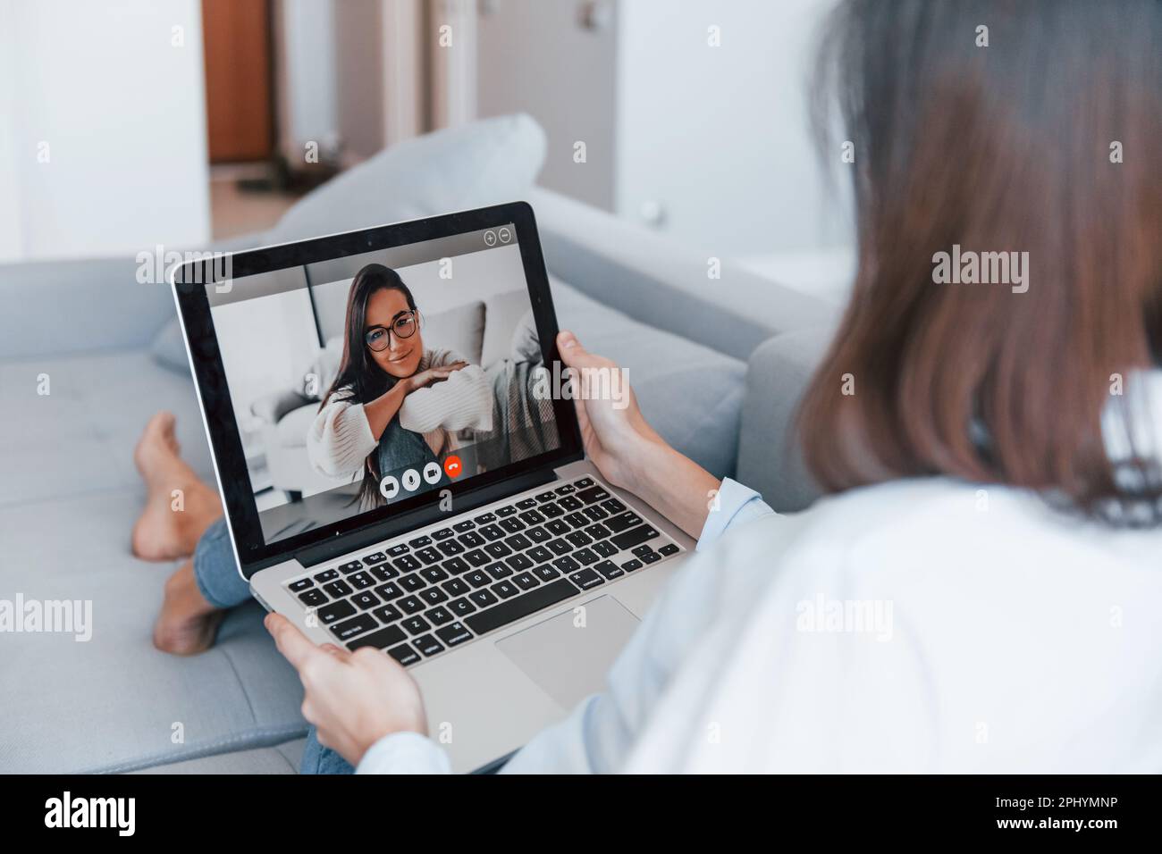 Two young women have online conversation by using tablet Stock Photo ...