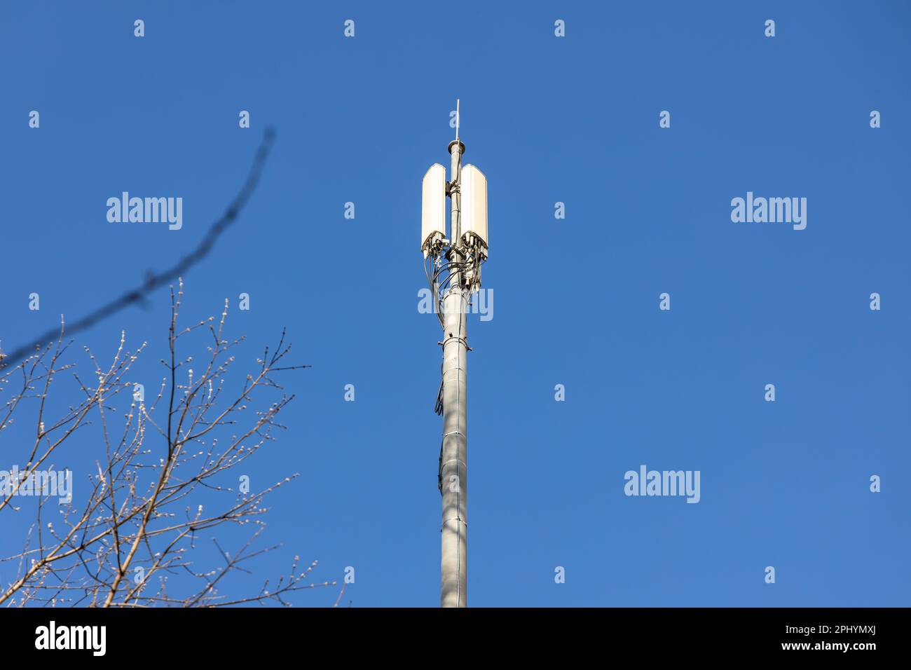 Close up of antenna repeater tower on blue sky Stock Photo - Alamy