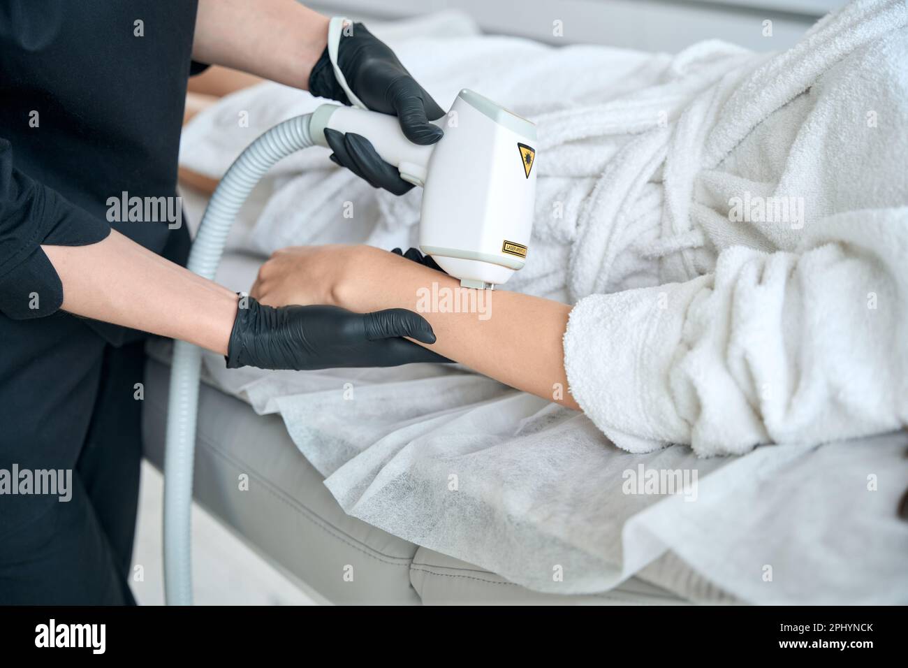 Close up photo of hand laser hair removal procedure Stock Photo - Alamy