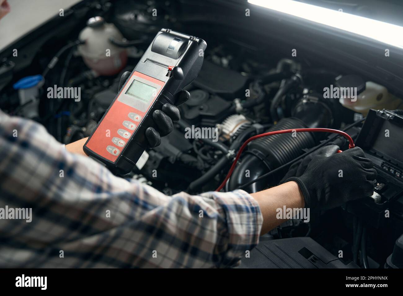 Procedure of computer diagnostics of car in car repair shop Stock Photo ...