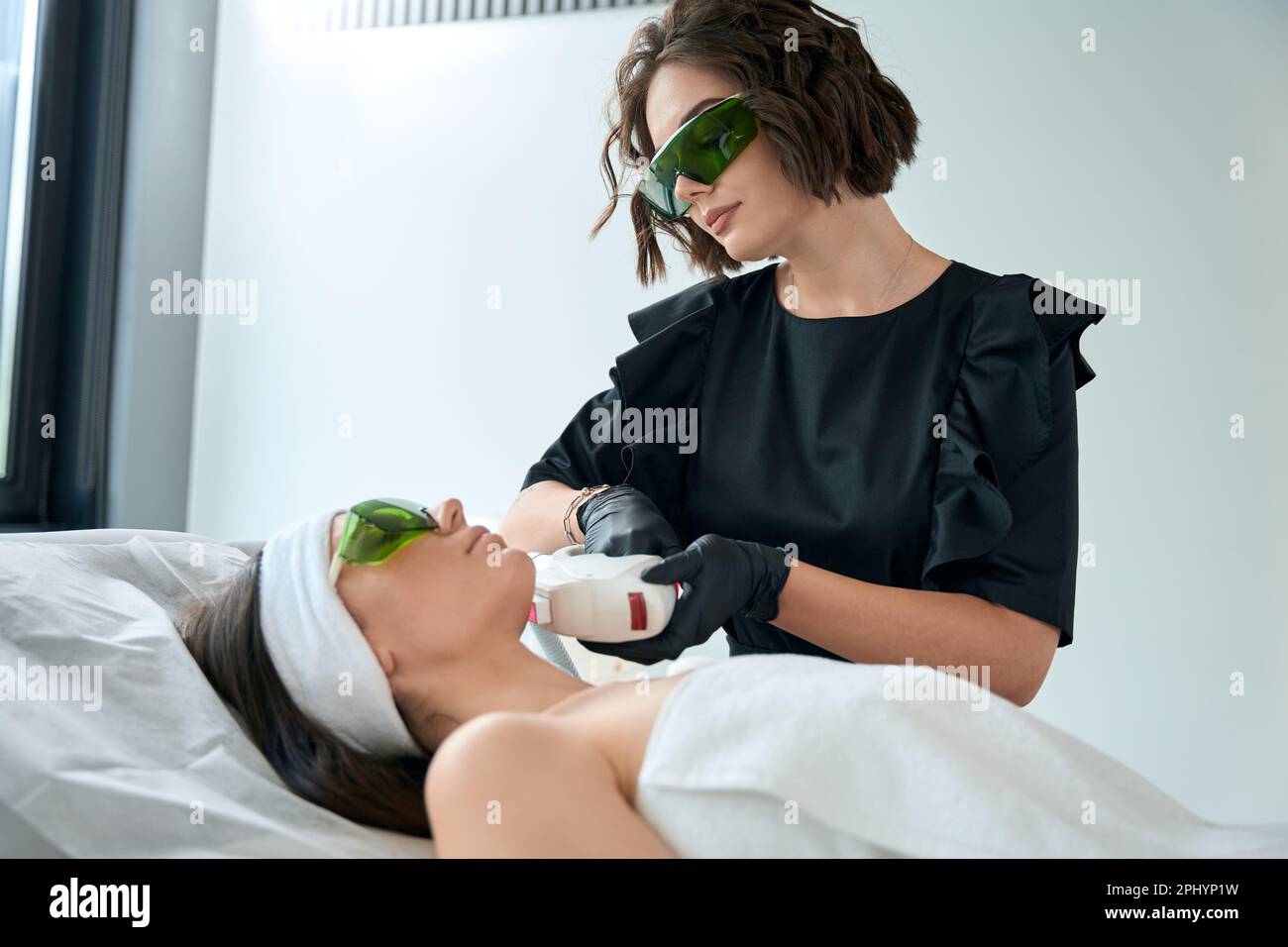 Beautiful female on laser hair removal procedure Stock Photo - Alamy