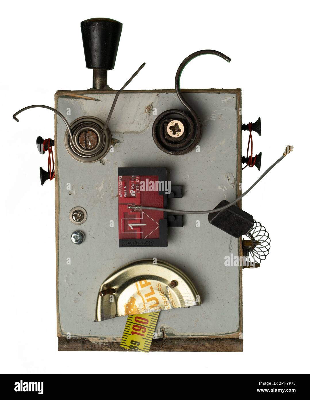 A robotic head made of wood and various small industrial parts isolated ...