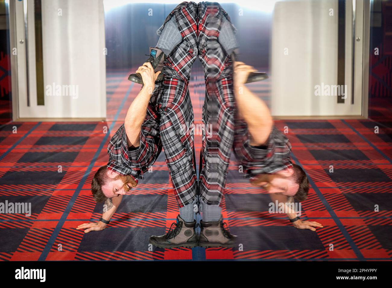 Yoga teacher Finlay Wilson wears the Kilted Yoga tartan during a ...